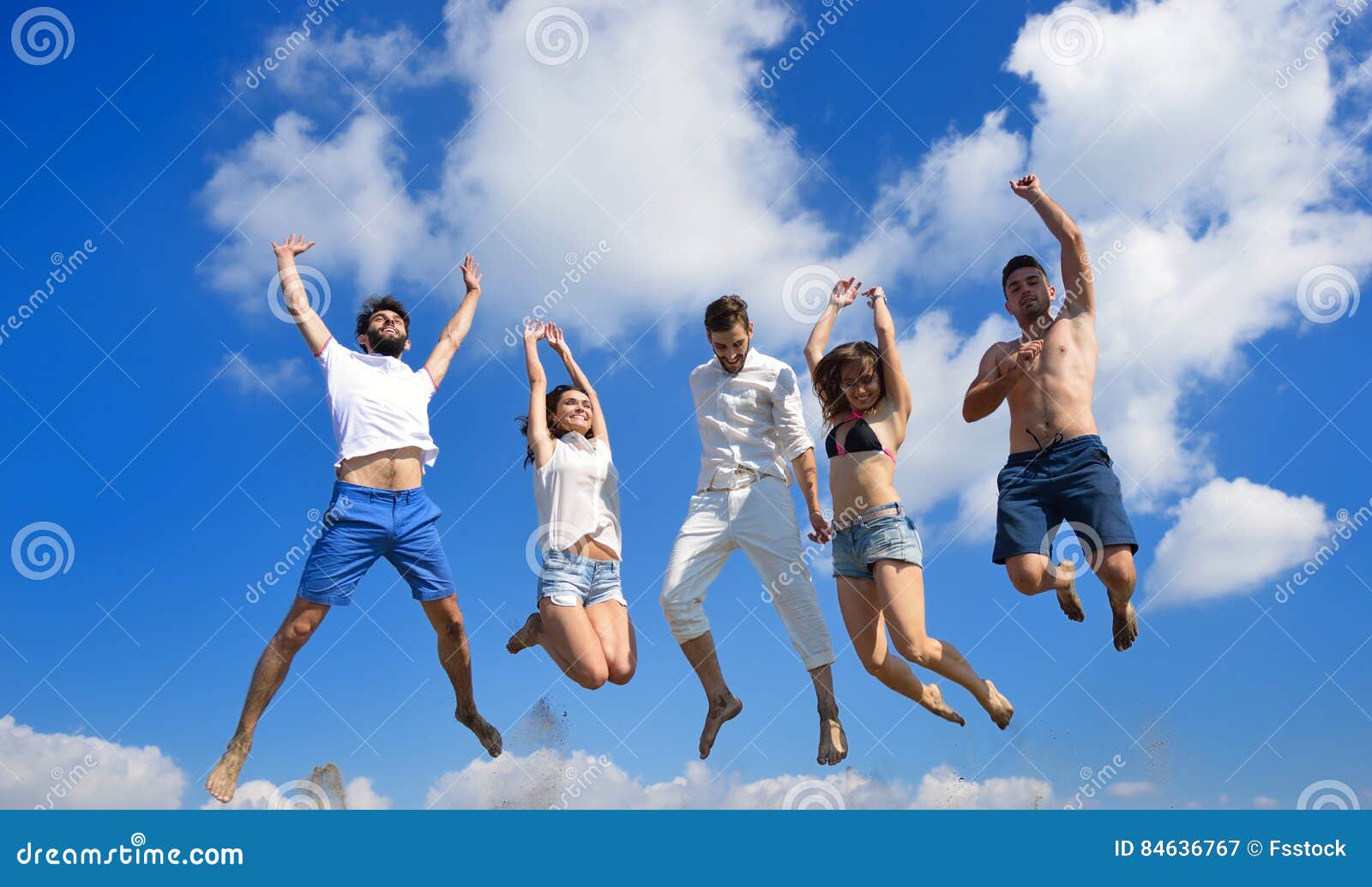 Image of Five Energetic People Jumping at the Beach Stock Image - Image ...