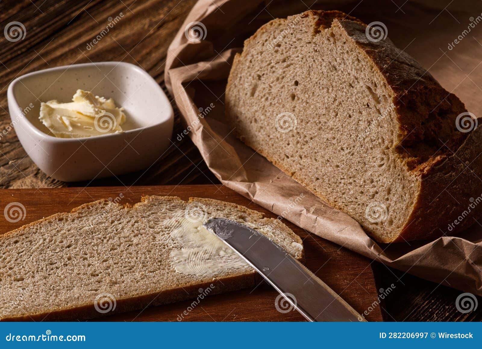 Image of Freshly-baked Bread Spread with a Generous Layer of Butter ...