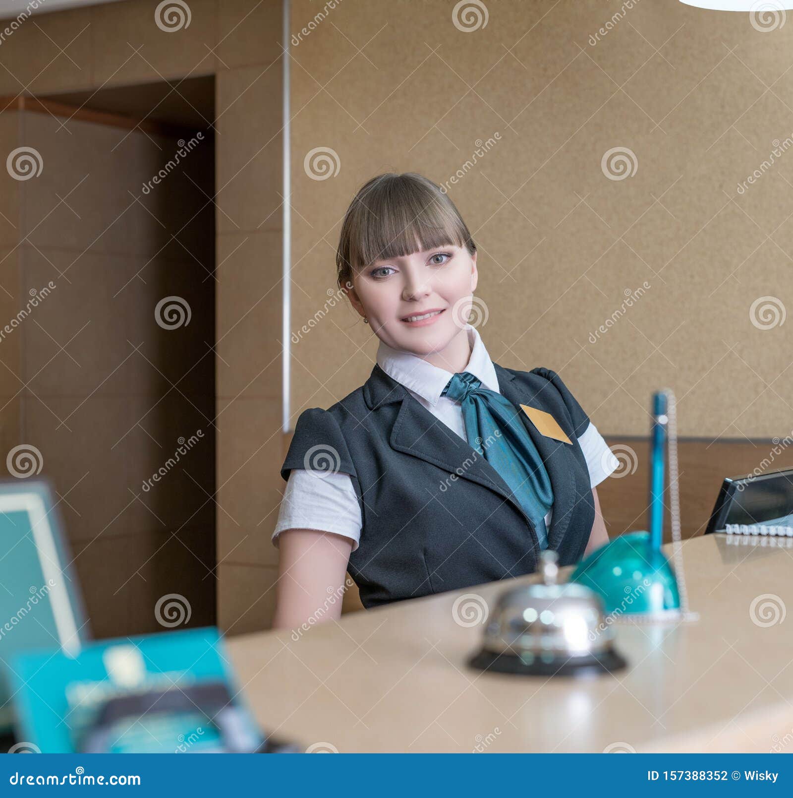Friendly Hotel Worker Posing Behind Reception Stock Photo - Image of ...