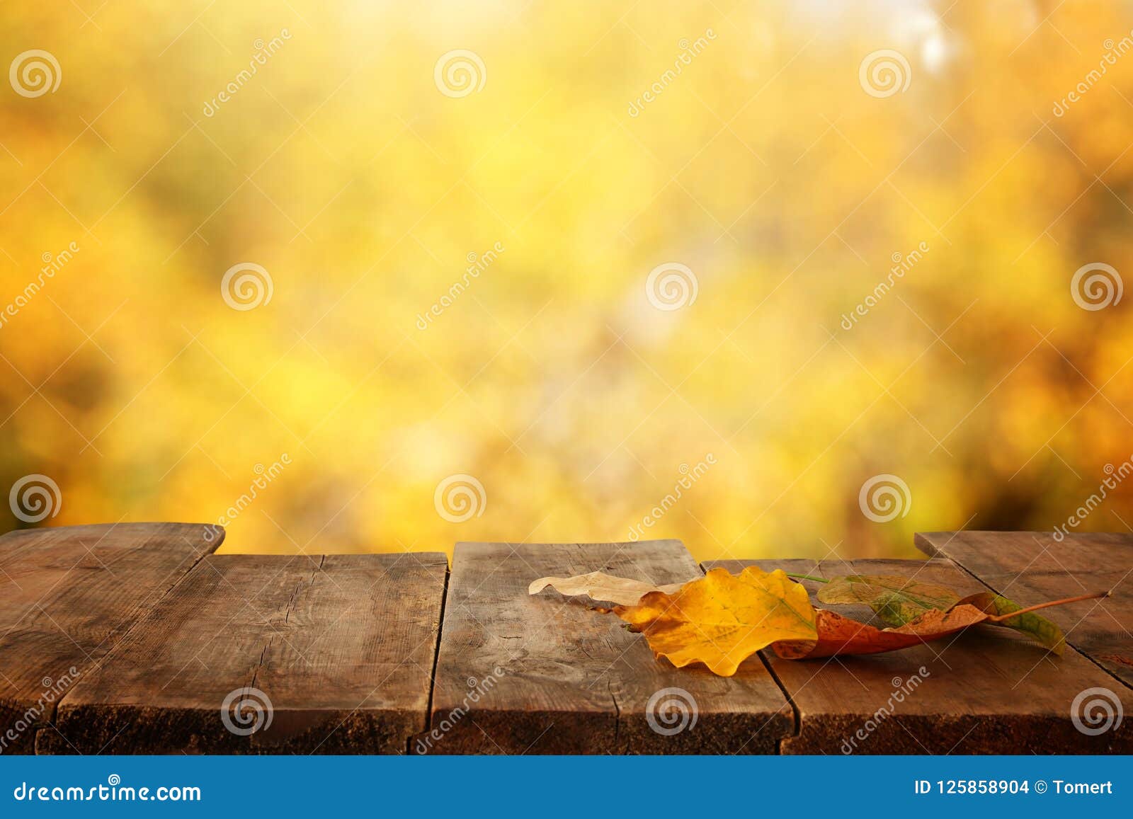 Image of Front Rustic Wood Table with Dry Gold Leaves and Fall Bokeh ...