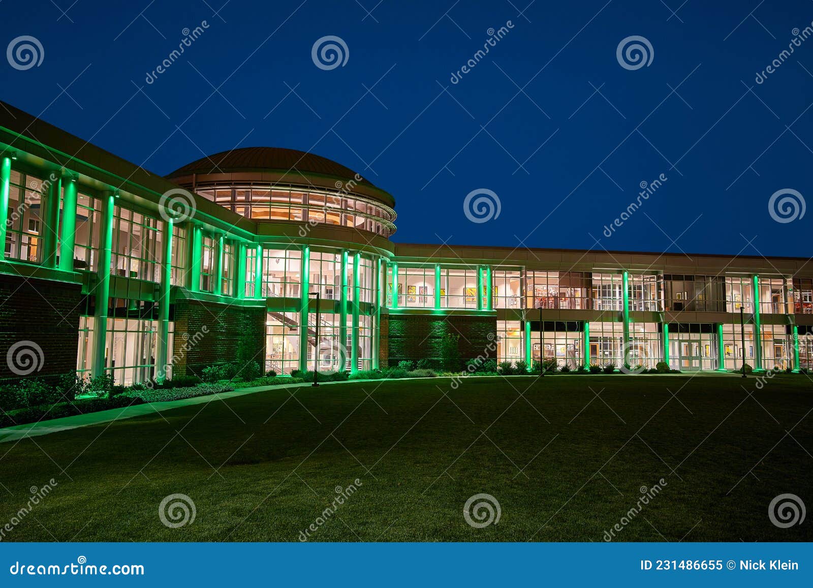 Front View of a Dormitory at a University with Green Lighting the ...