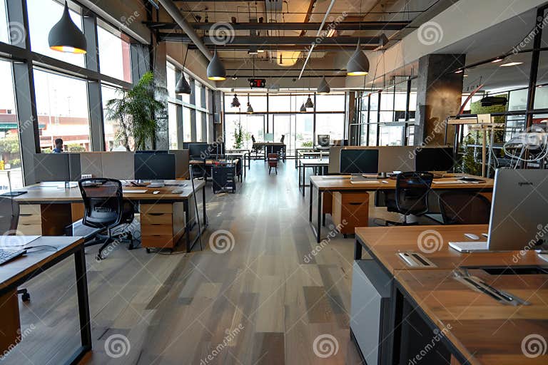 A Modern Open Floor Plan Office with Spacious Desks and Collaborative Workspaces Stock ...