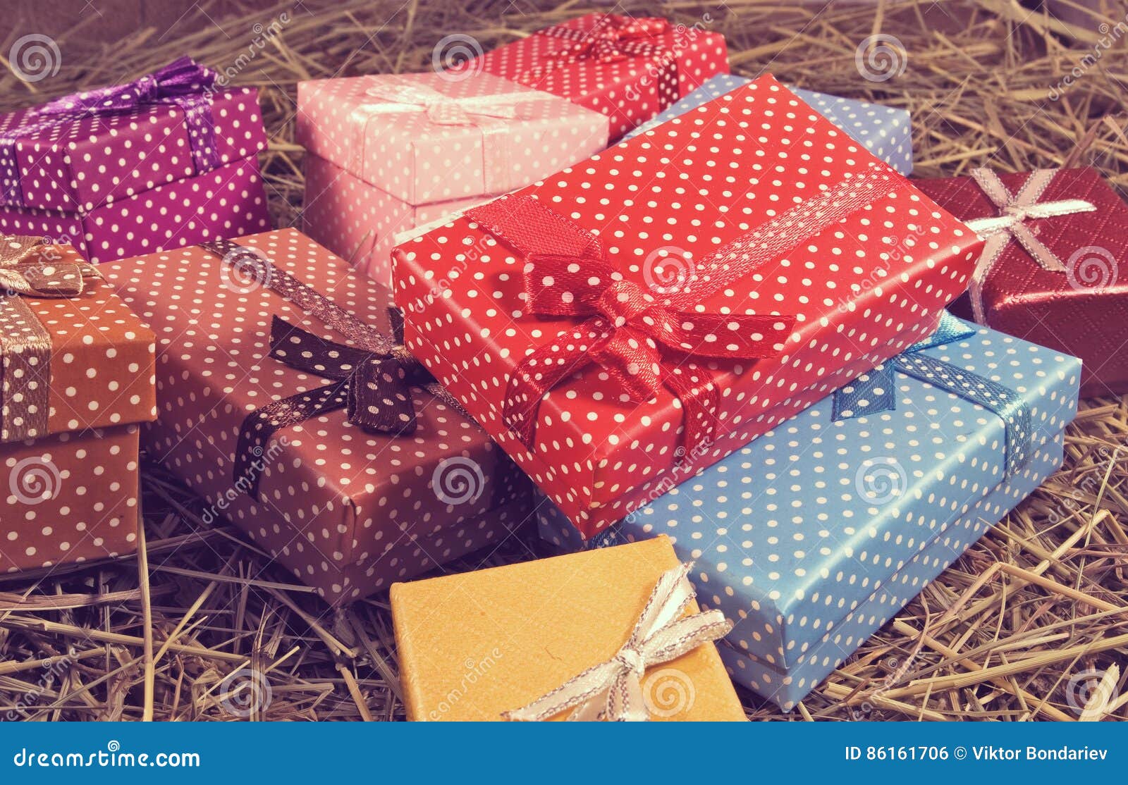 Image of Gift Boxes in the Hay Closeup Stock Photo - Image of ribbon ...