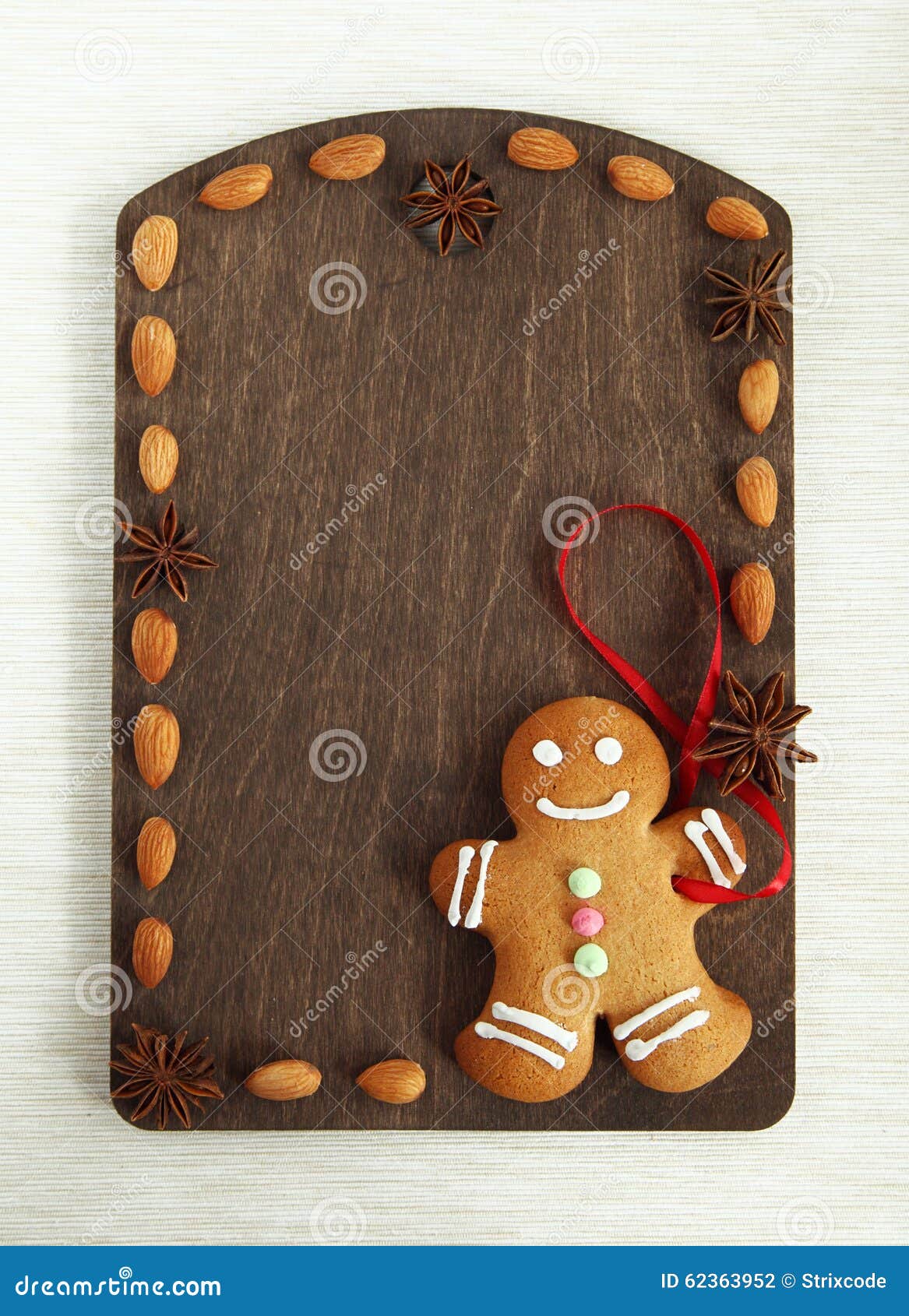Image of Gingerbread Man on Brown Cutting Board Stock Photo - Image of ...