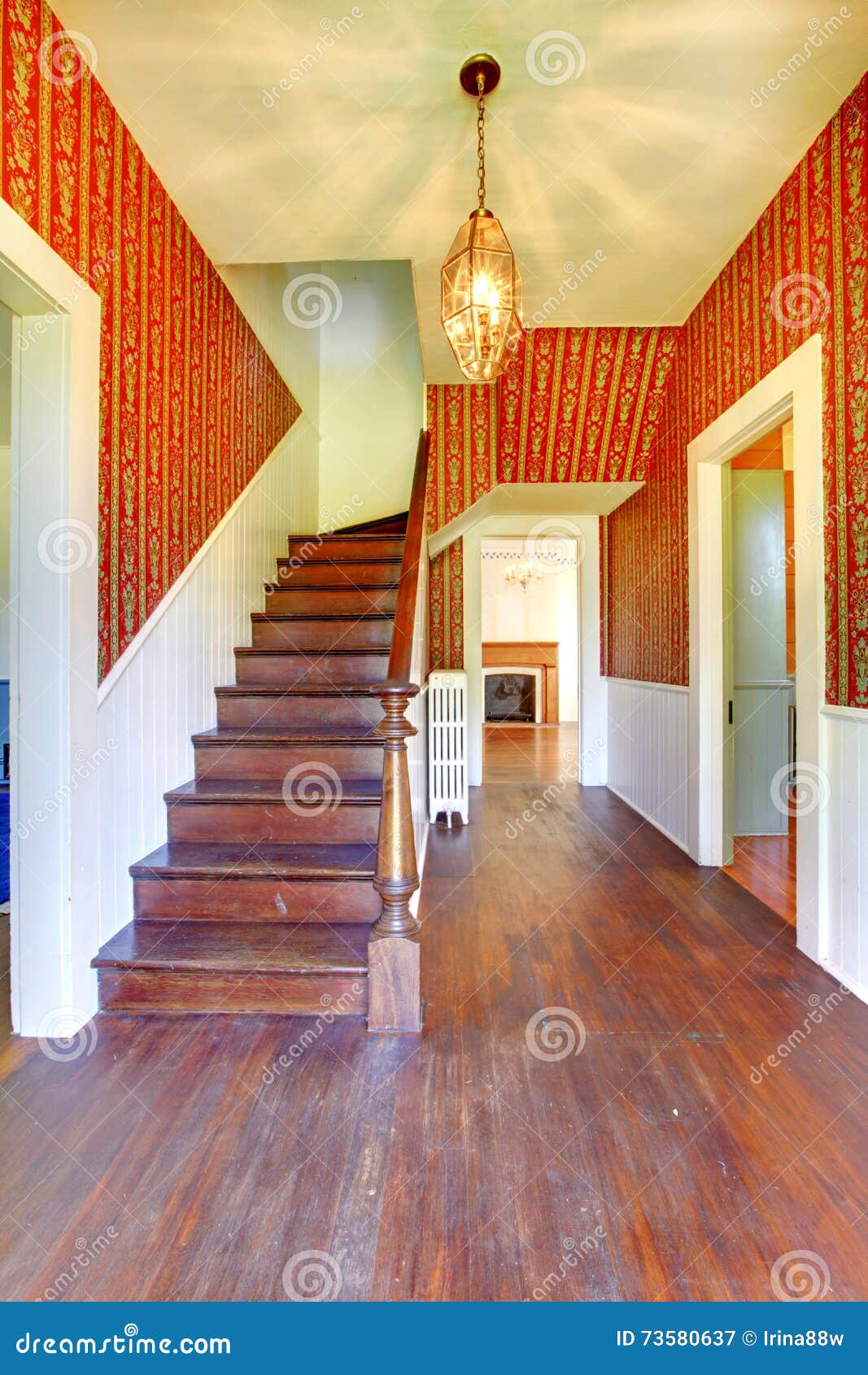 Image of Hallway with Wooden Staircase and Red Pattern Wallpaper Stock ...