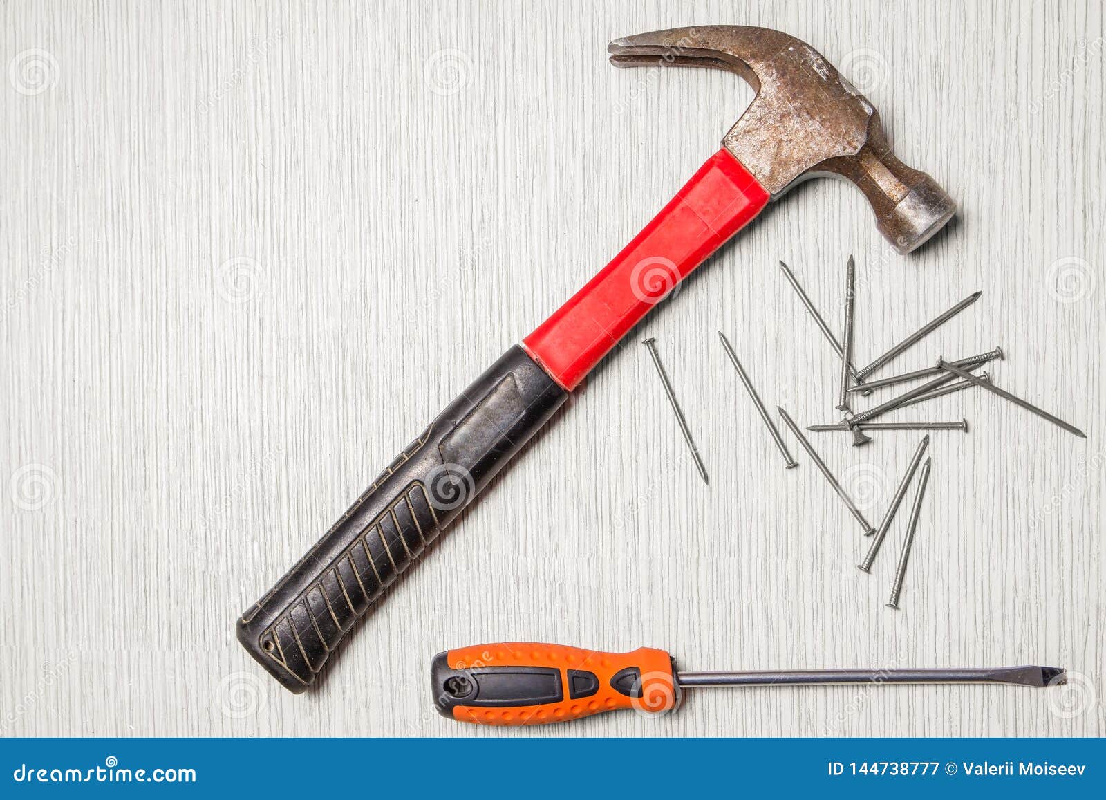 An Image of Hammer, Screwdriver and Nails on Wooden Table Stock Image ...