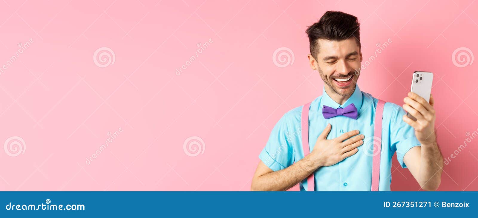 Image of Handsome Guy Laughing during Video Chat, Having Mobile ...