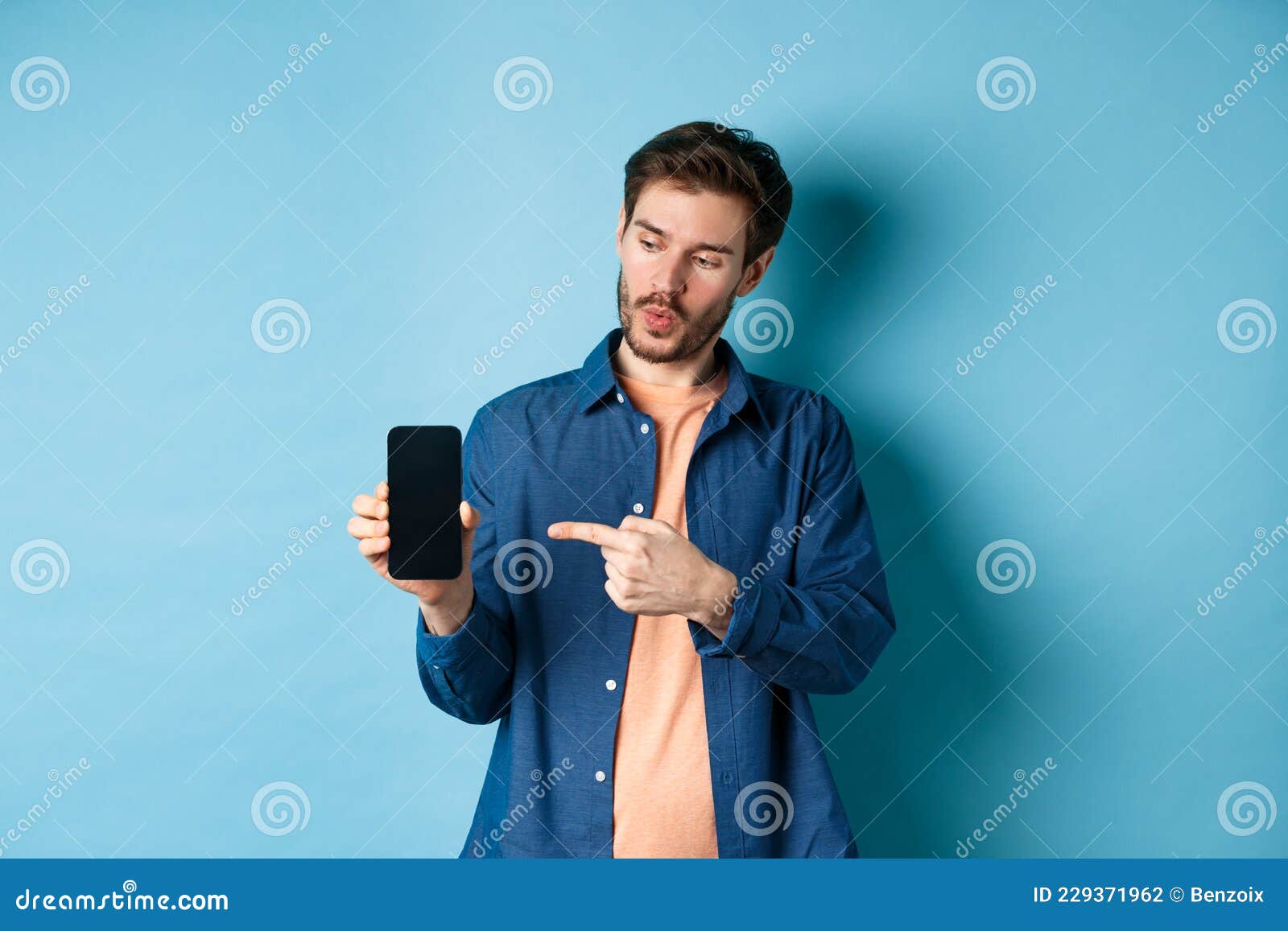 Image of Handsome Man Talking about Application, Pointing Finger at ...