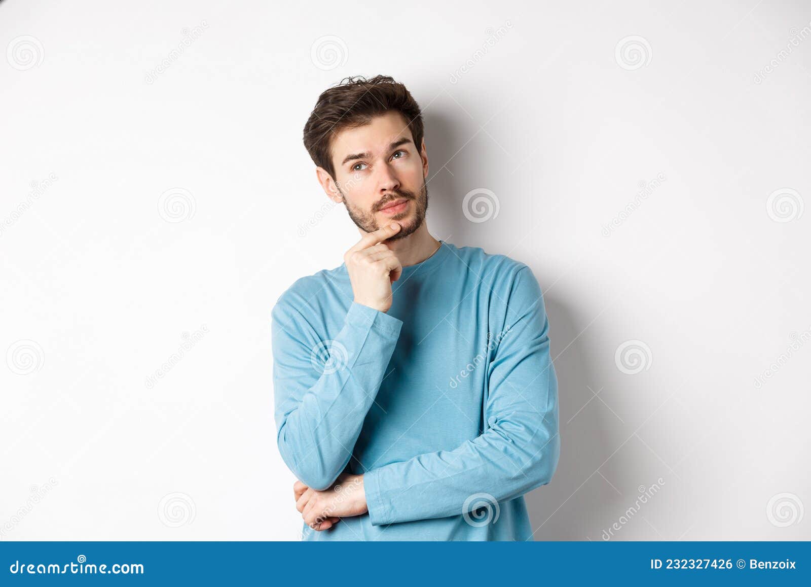 Image of Handsome Young Man Making Choice, Thinking and Looking Pensive ...