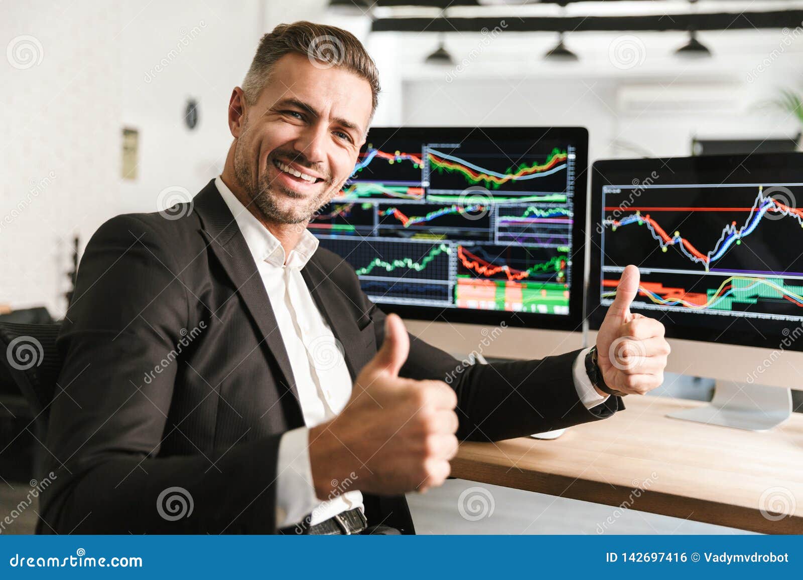 Image of Happy Businessman Working in Office on Computer with Graphics ...