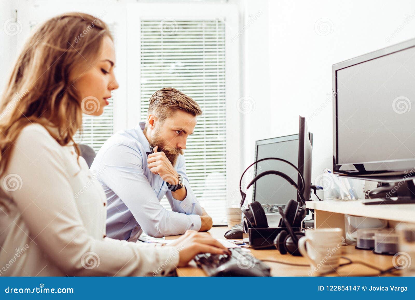 Colleagues Working on Desktop Computer Stock Image - Image of ...
