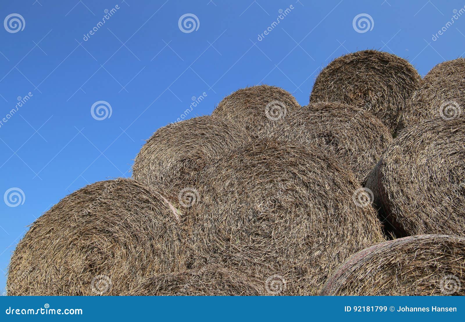 Image of Heap of Hay Bales with a Blue Sky Stock Image - Image of stack ...