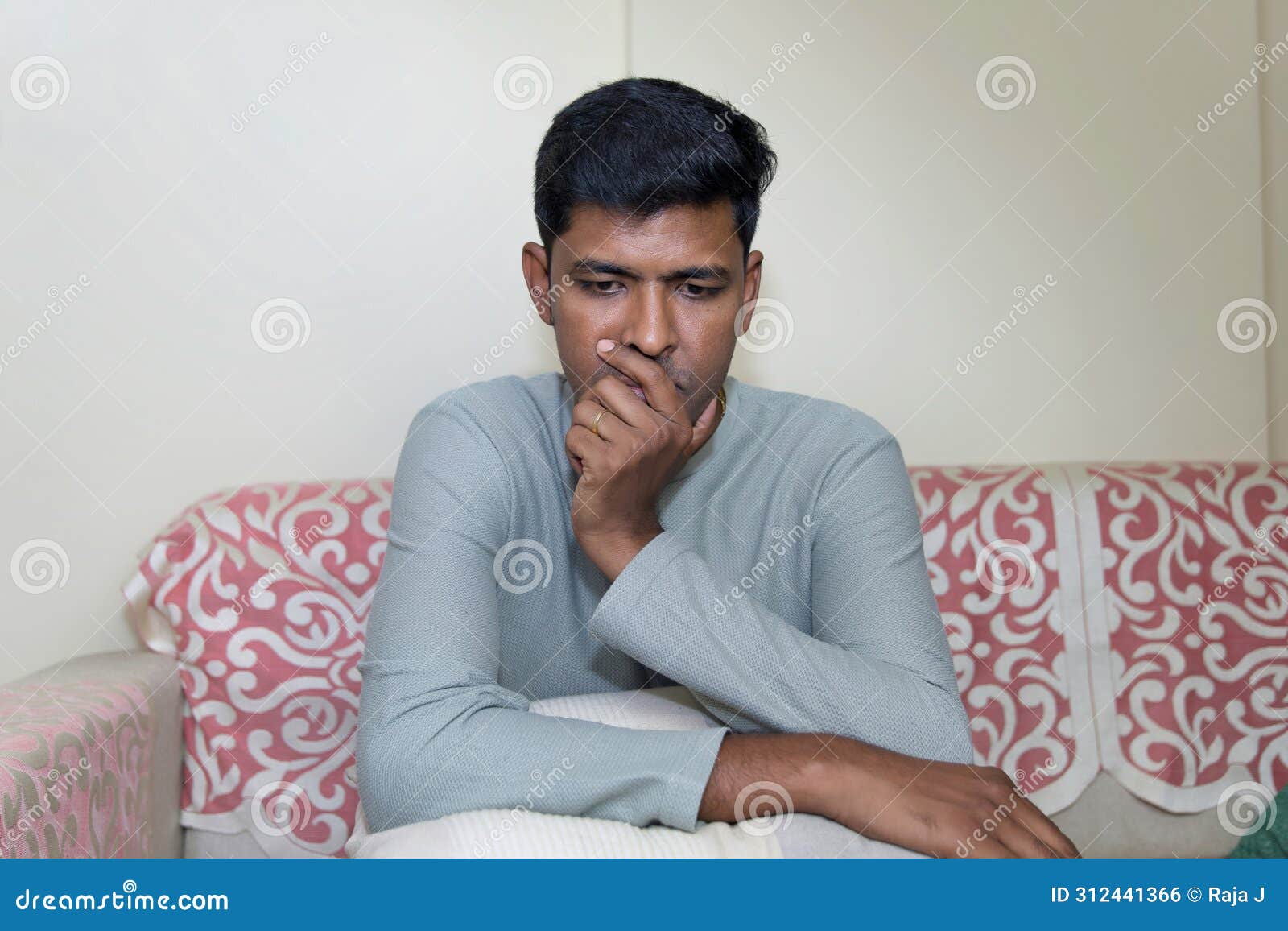 Indian Man Sadly Sitting on the Sofa at Home Stock Photo - Image of ...