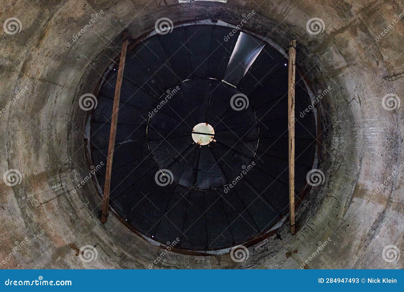 Interior of Concrete Silo with Black Camera Shutter Like Roof or ...
