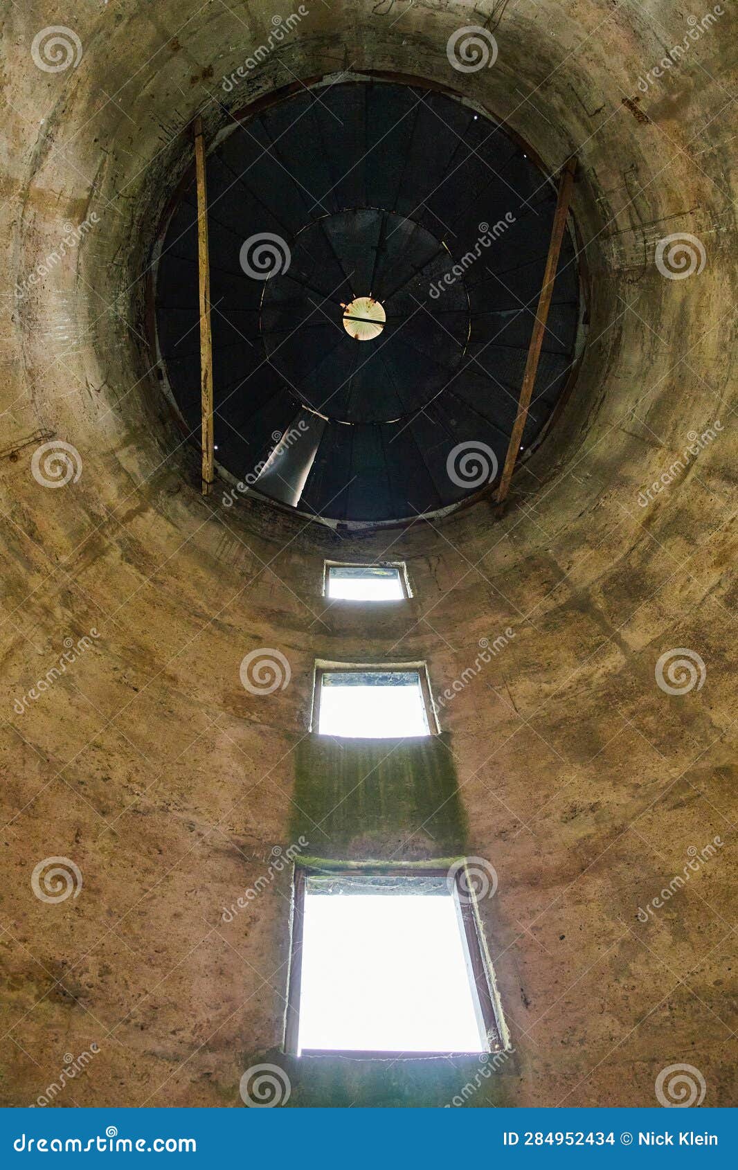 Interior of Old Silo with Busted Windows and Ceiling Like Shutter of a ...