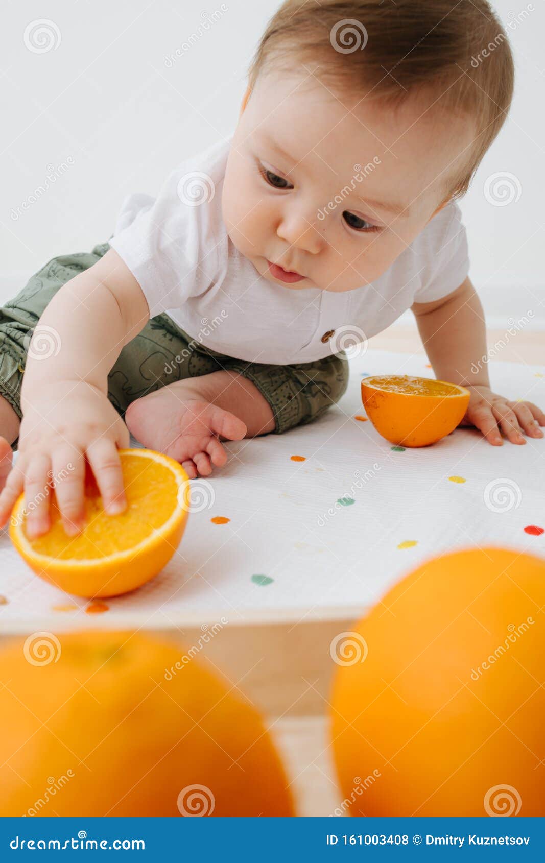Image of Jolly Infant Child with Orange Stock Photo - Image of ...