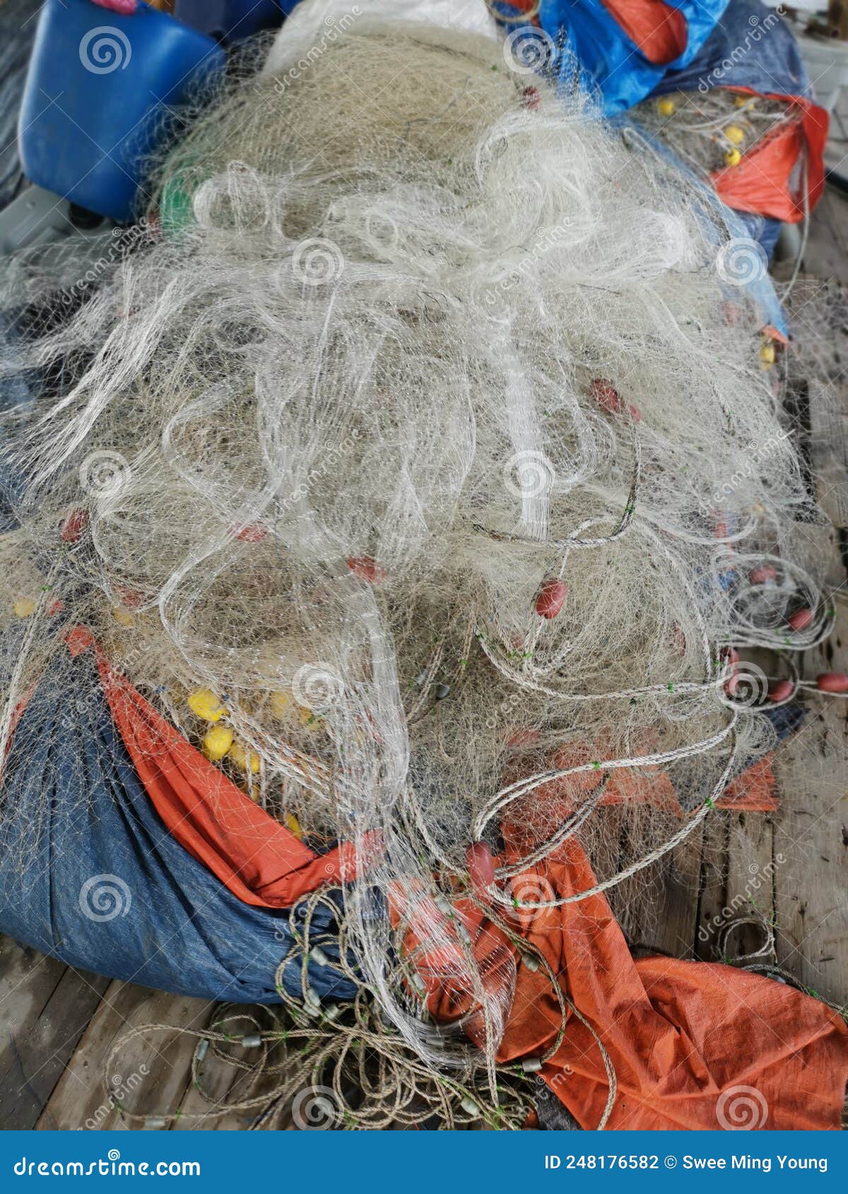 Knitting Fishing Net and Tool on the Ground. Stock Photo - Image of ...