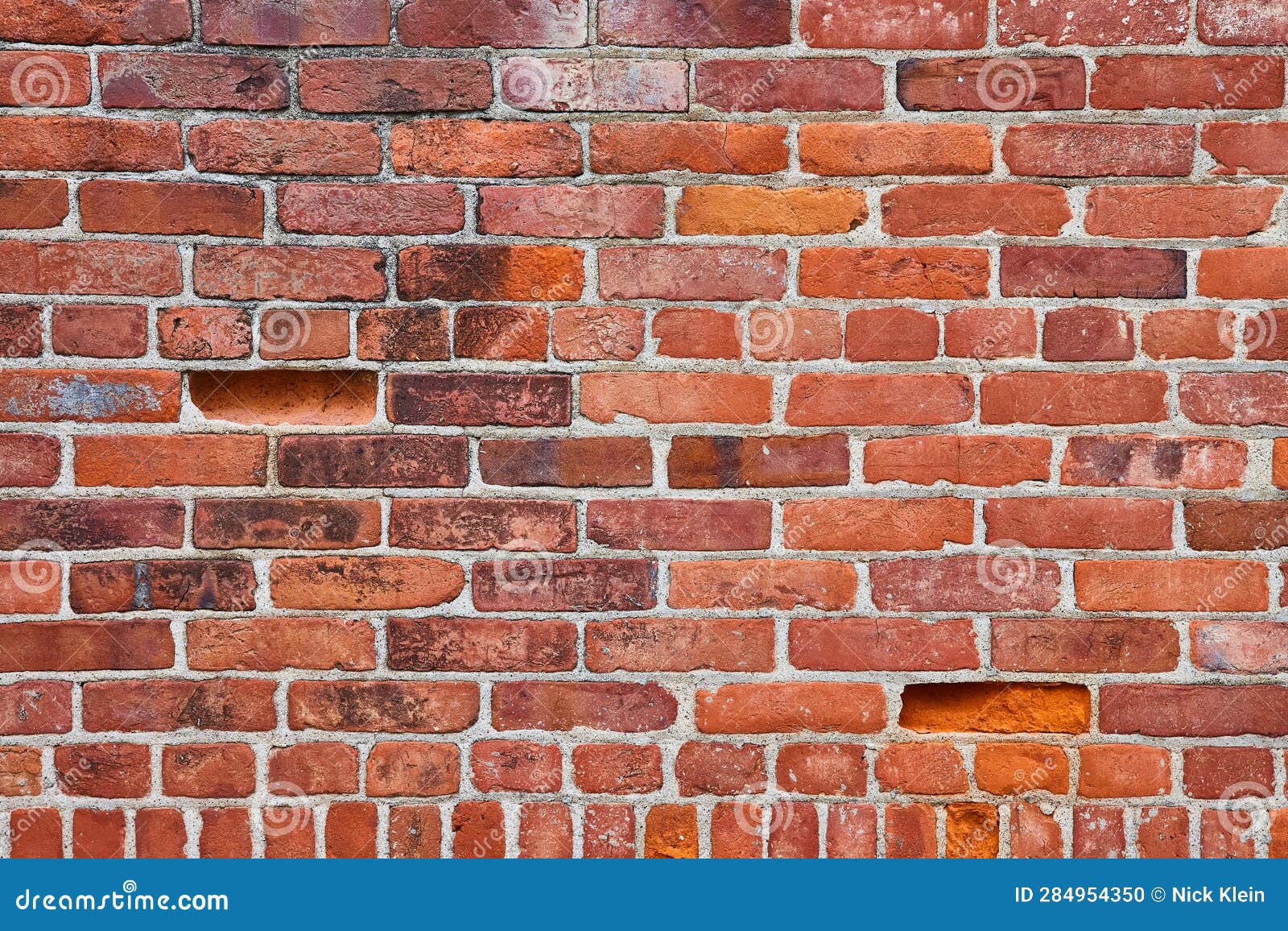 Lots of Red Bricks on Wall with Two Indented and Bottom Row of Tiny and ...