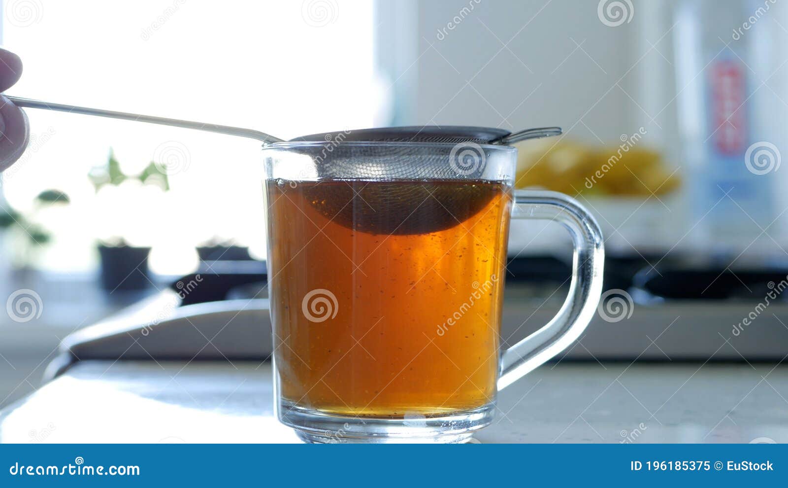 Image with Making a Hot and Aromatic Tea Using a Strainer and Natural ...