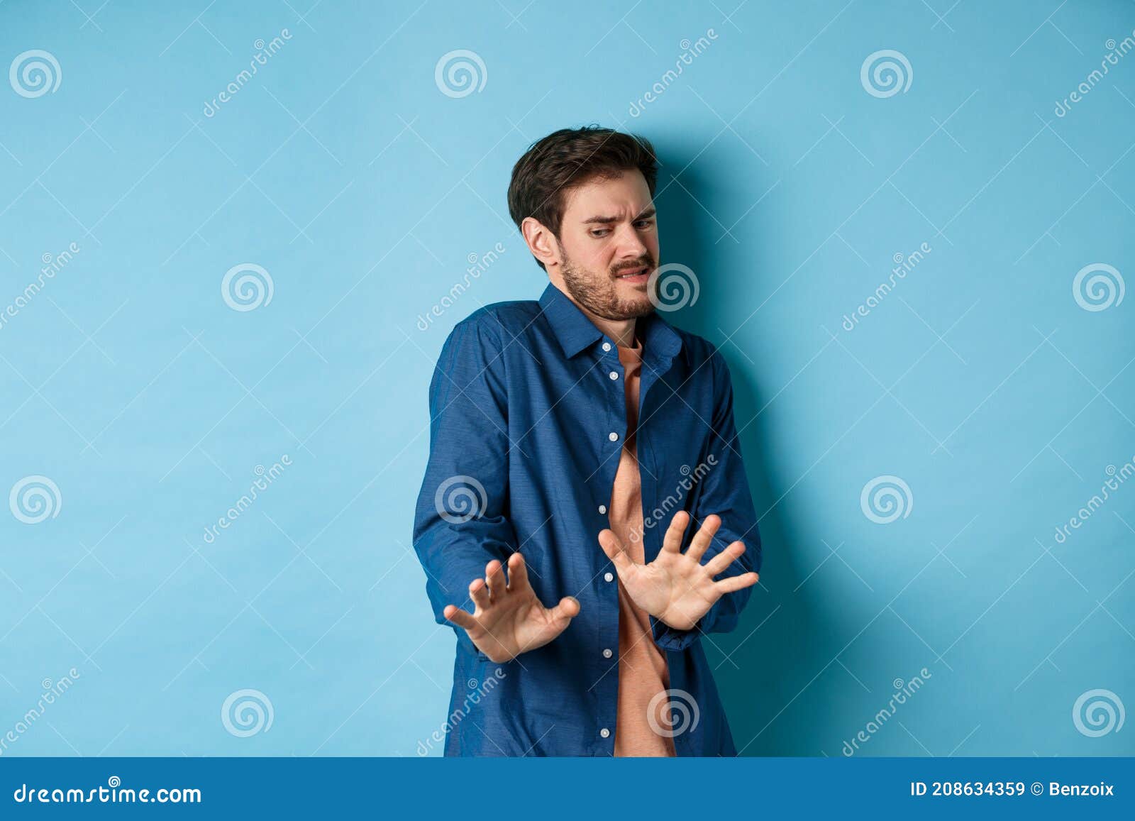 Image of Man Cringe and Look at Something Disgusting, Step Back from ...