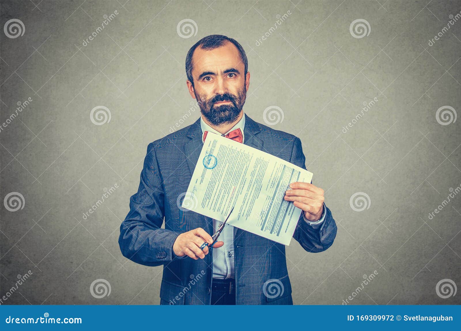 Image of Man Cutting a Document with Scissors. Cancel a Contract ...