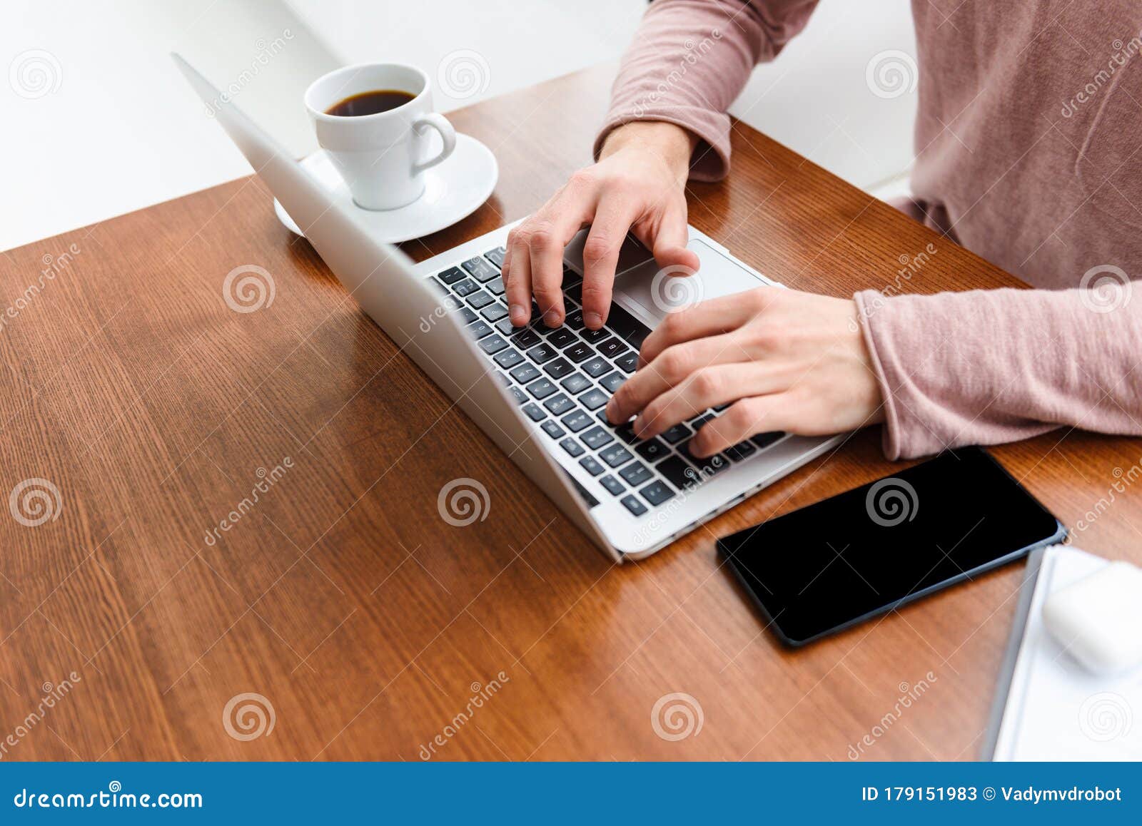 Image of Man Drinking Coffee and Working on Laptop Computer in Cafe ...