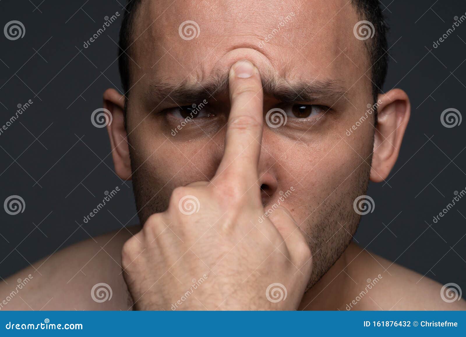 Image of Man with Forefinger on Forehead Stock Photo - Image of young ...