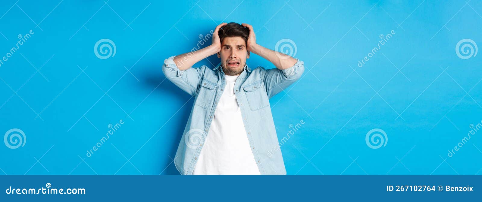 Image of Man in Panic Holding Hands on Head, Looking Frustrated and ...