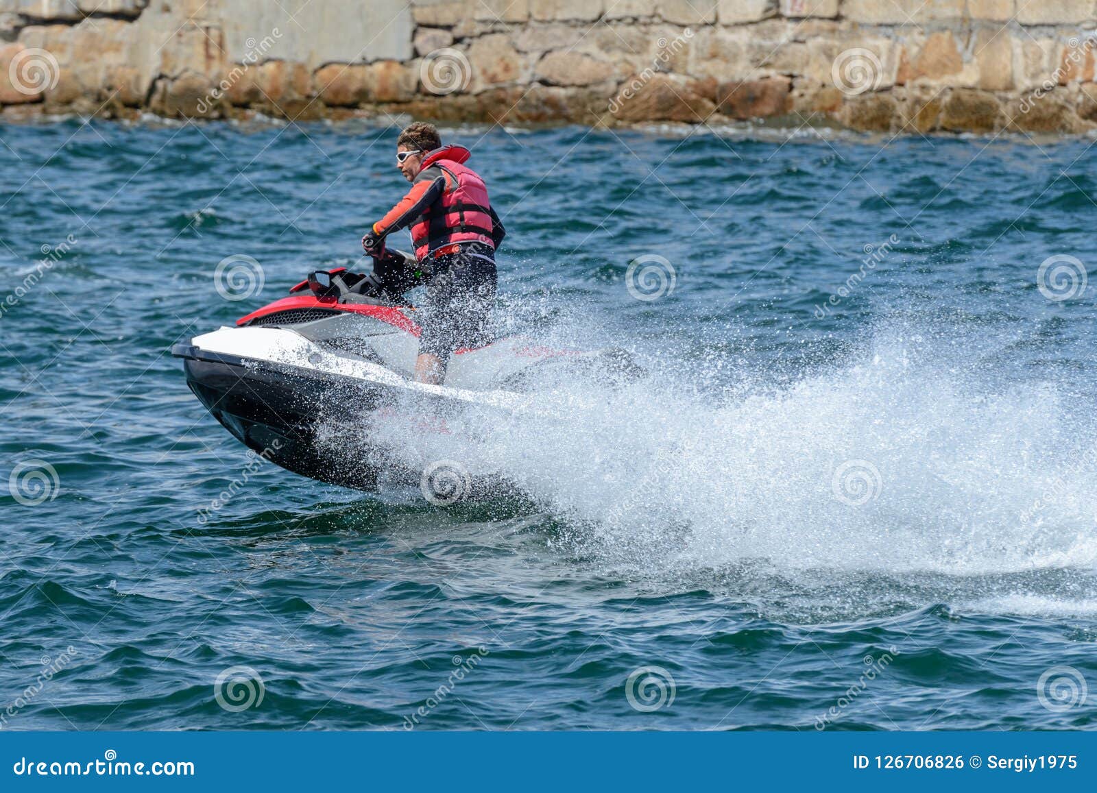 Man is riding a hydrocycle stock photo. Image of riding - 126706826