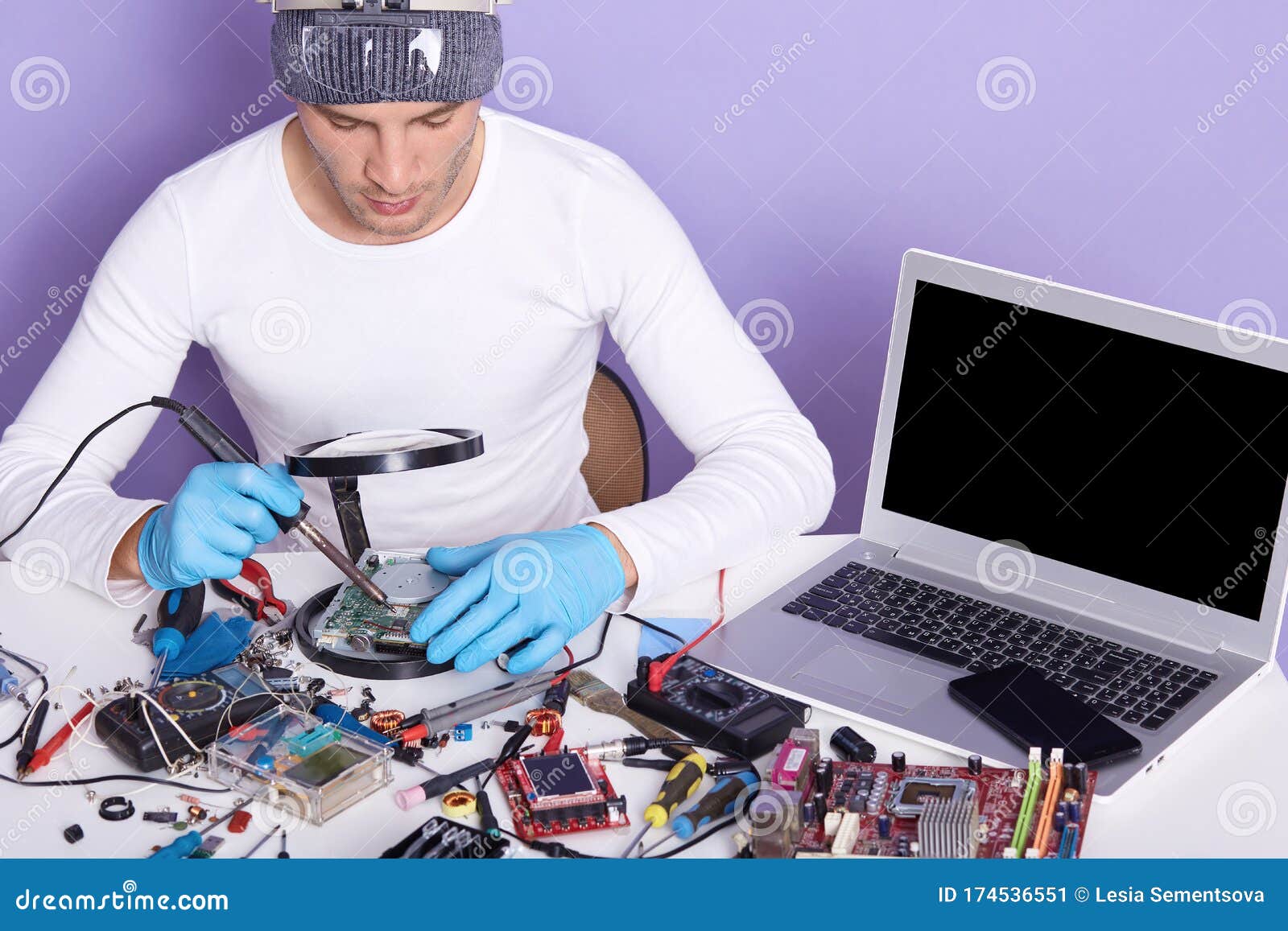 Image of Man Using Magnifier while Looking on Wires of Pc, Concentrated ...