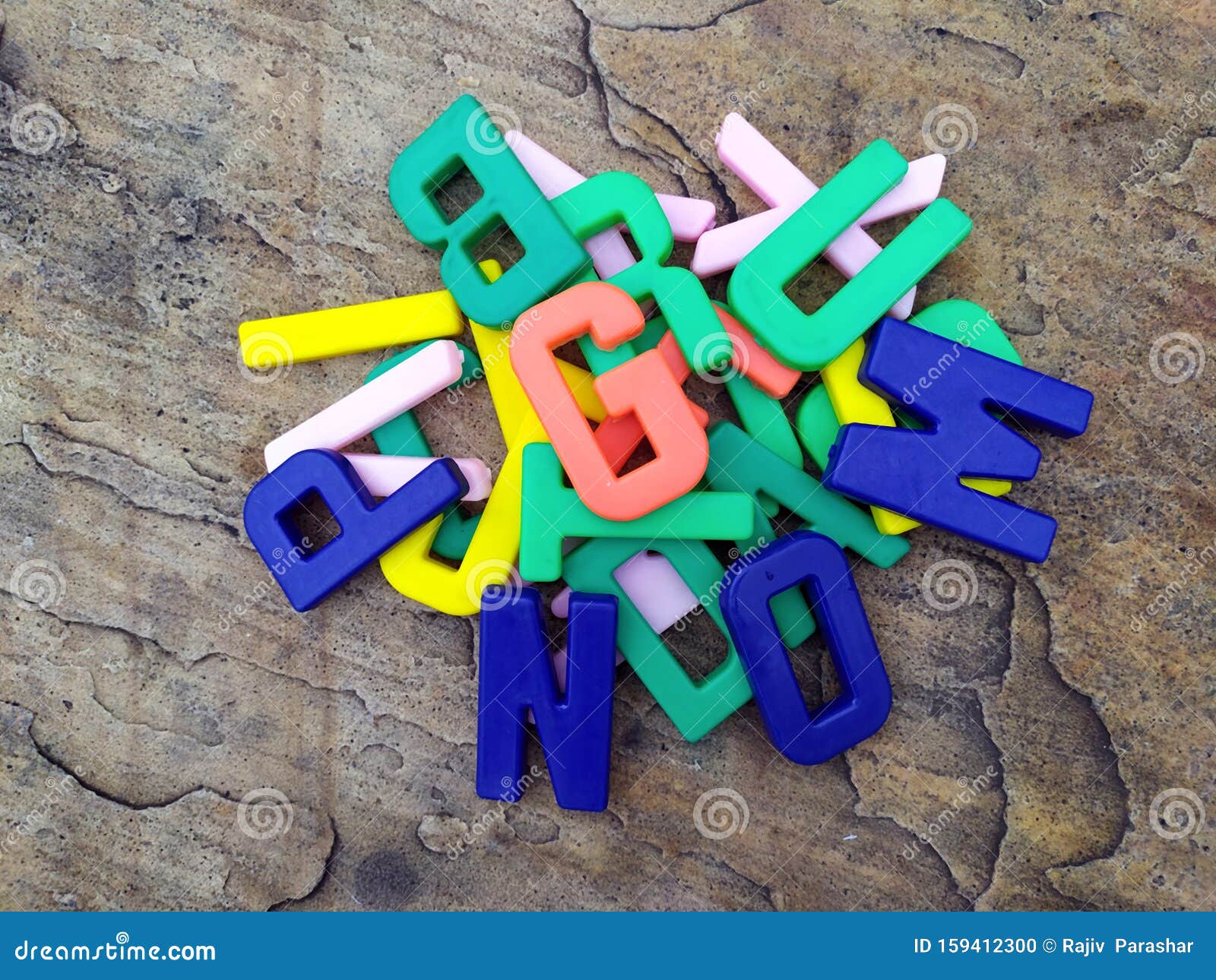 Multi Color Alphabet Letter Isolated on Stone Background Stock Photo ...
