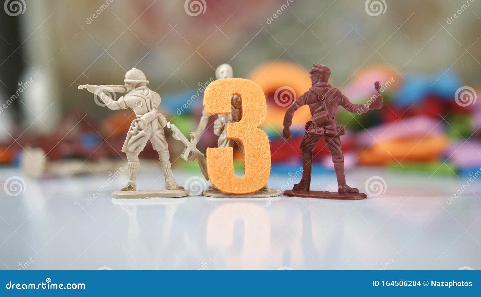 Image of Number 3 with Three Toy Soldiers at Background Stock Photo ...