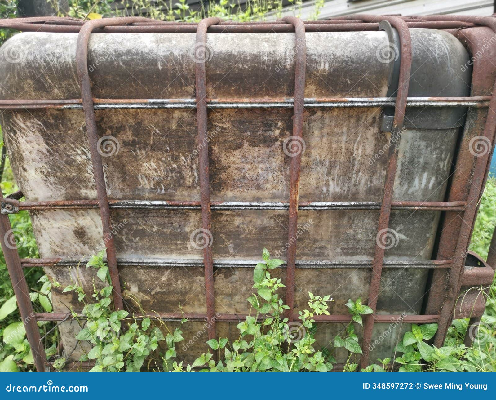 Old HDPE Tank with Rusty Metal Cage Frame Container Stock Photo - Image ...