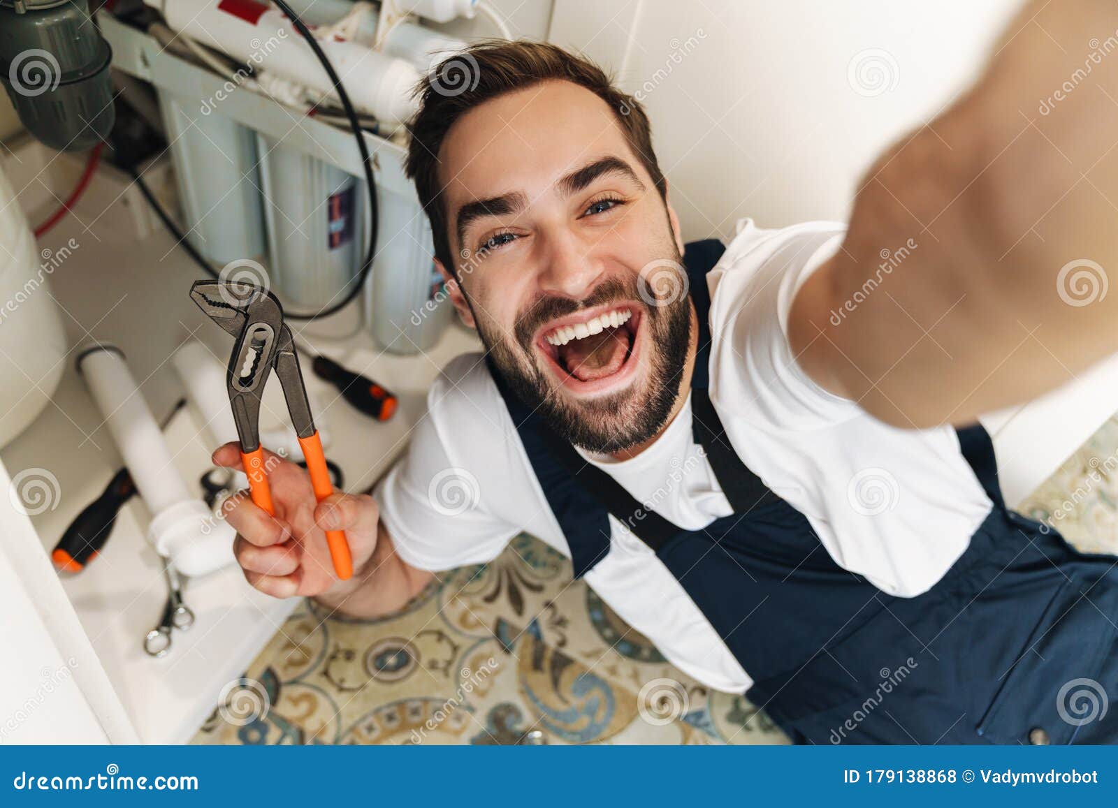 Optimistic Young Man Plumber Work in Uniform Stock Photo - Image of ...