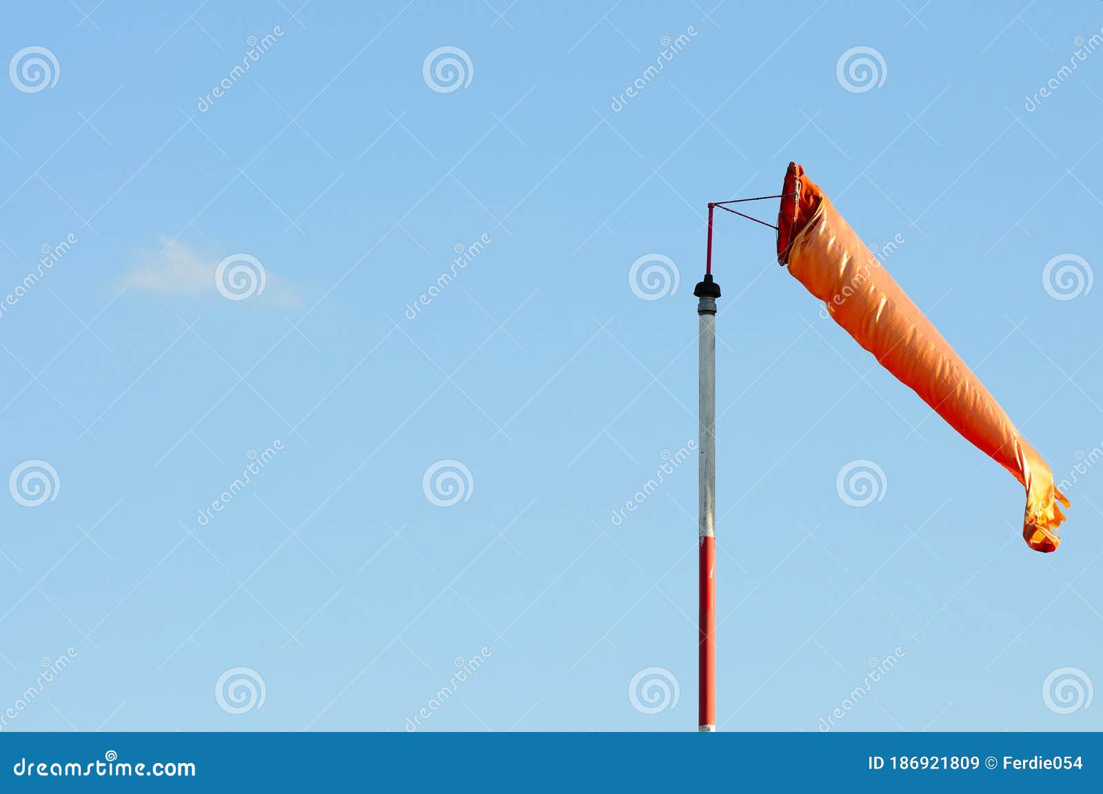 An Orange Windsock or Windvane Against the Blue Sky Stock Image - Image ...