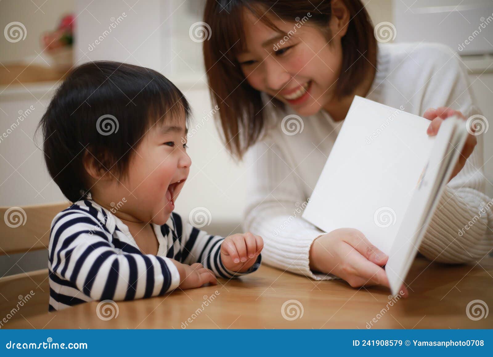 Parent and child reading stock image. Image of conversation - 241908579