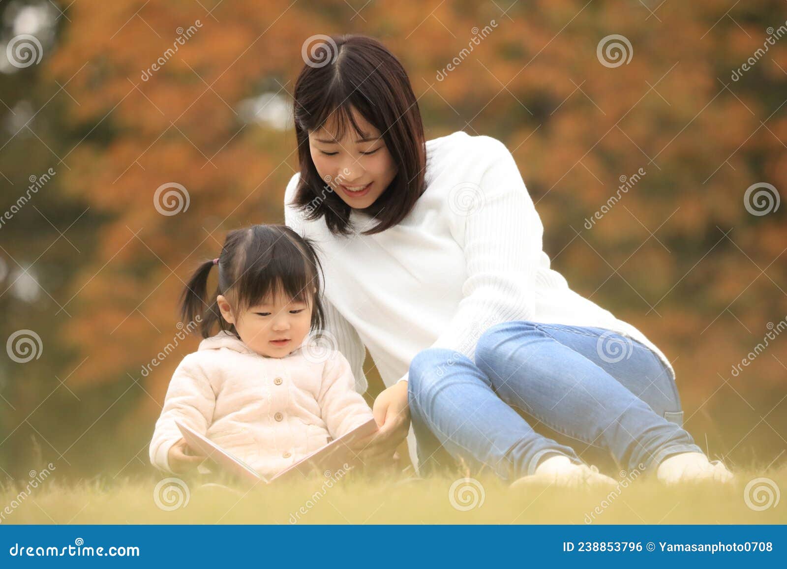 Parents and Children Reading Stock Photo - Image of outdoors, people ...
