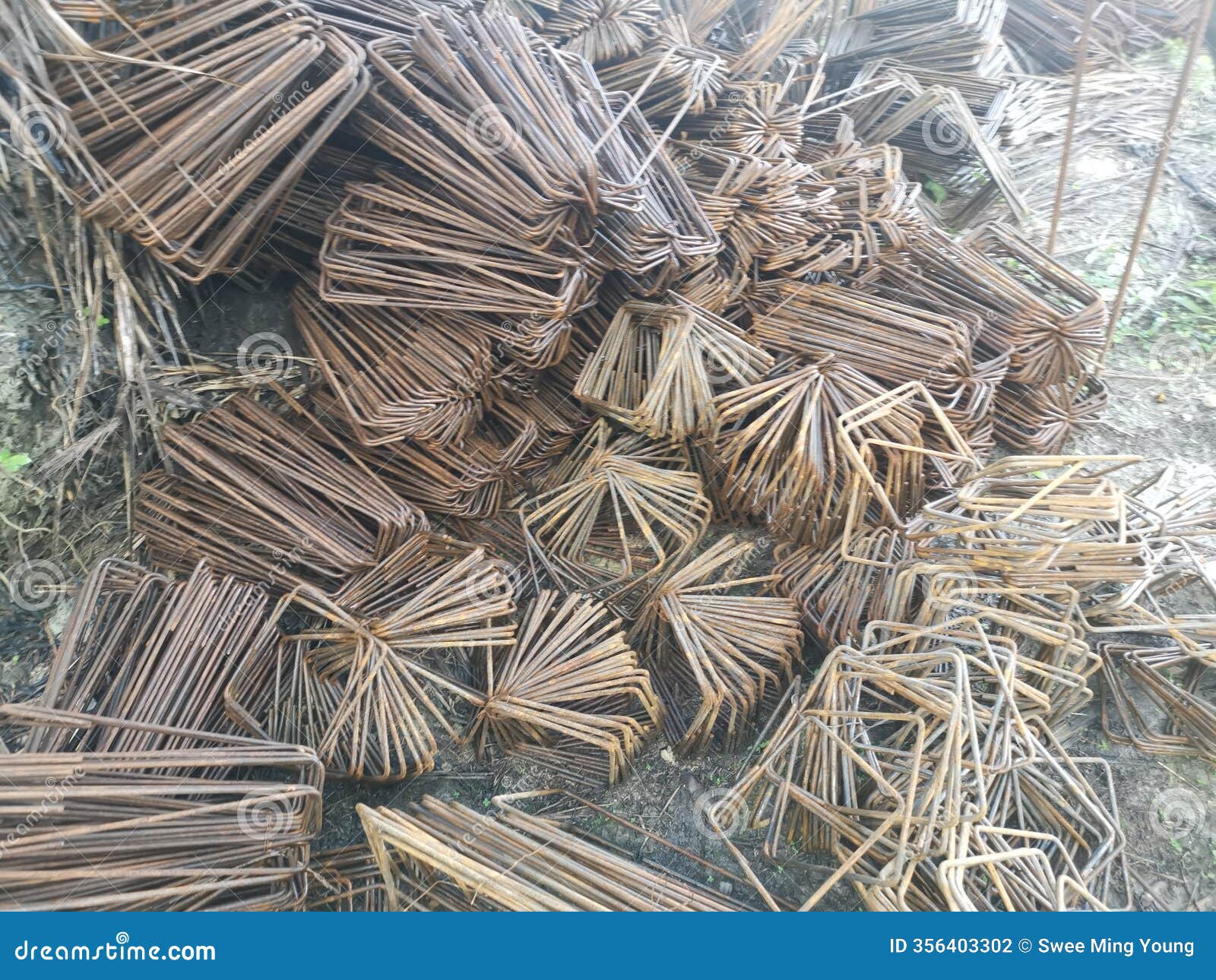 Piles of Bent Square-shaped Rusty Steel Grid Reinforcement Frame Lying ...