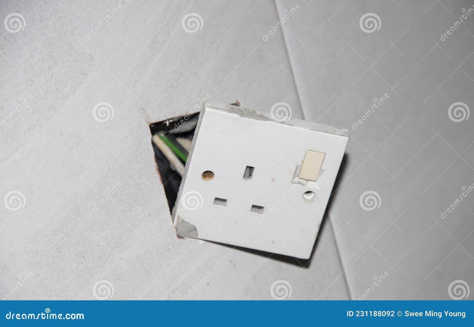 3-pin Plug Socket Adapter Hanging Out from the Wall Stock Photo - Image ...