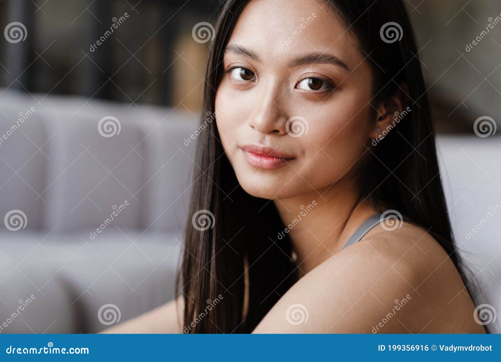 Image Of Pleased Beautiful Asian Girl Posing And Looking At Camera