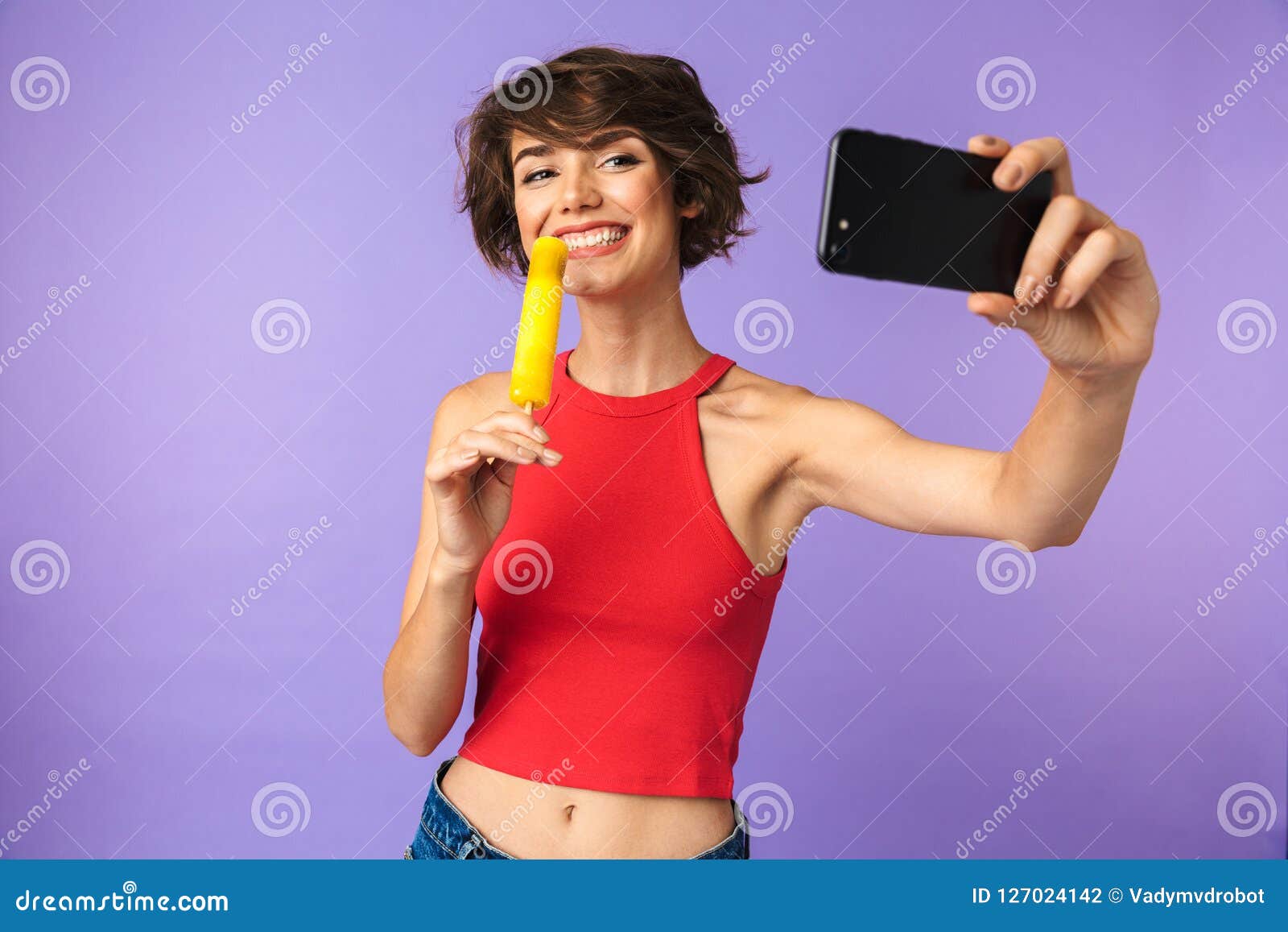 Image of Pleased Beautiful Woman 20s in Casual Wear Smiling and Stock ... Image of Pleased Beautiful Woman 20s in Casual Wear Smiling and Stock ...