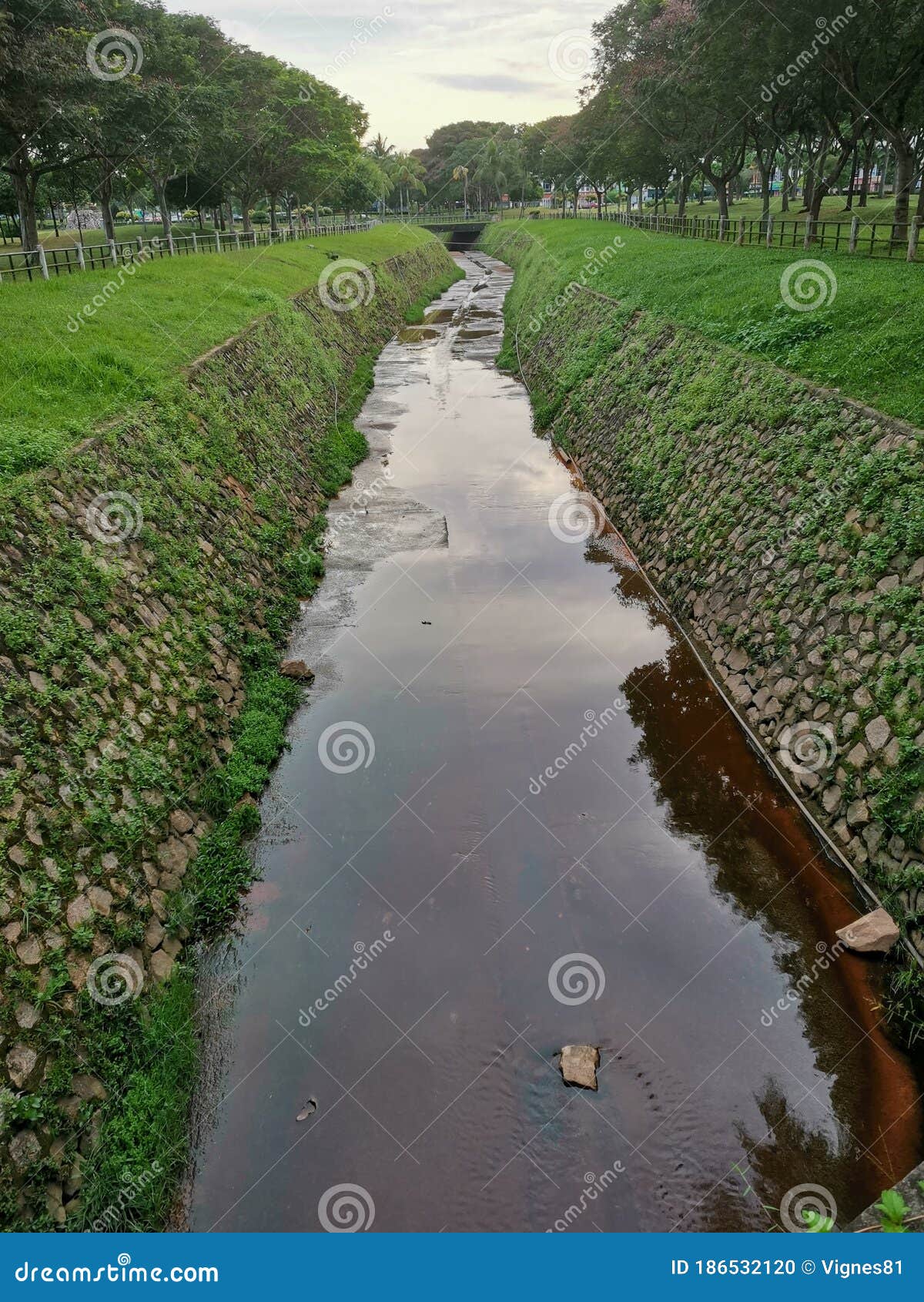 Polluted Water Along Drainage Stock Photo - Image of metal, brown ...