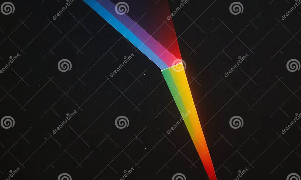 Vibrant Rainbow-colored Light Beam Pierces through Dark Background ...