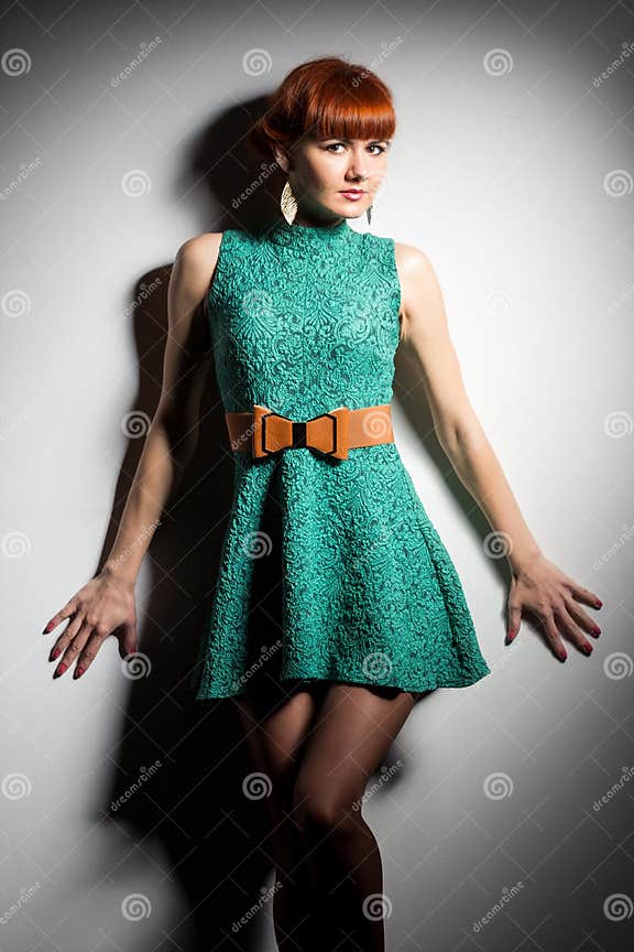 Image Of Pretty Redhead Young Lady In Green Dress Standing With Arms