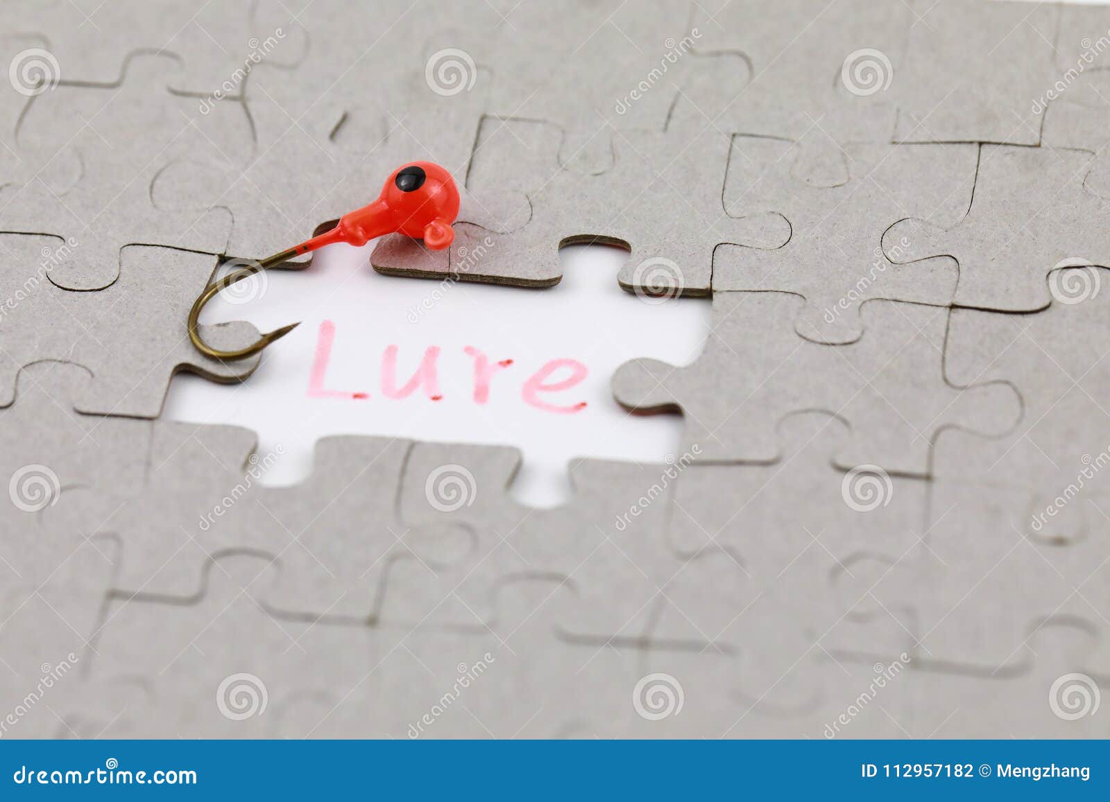 Image of Puzzle Piece with Lure and Fish Hook Stock Photo - Image of ...