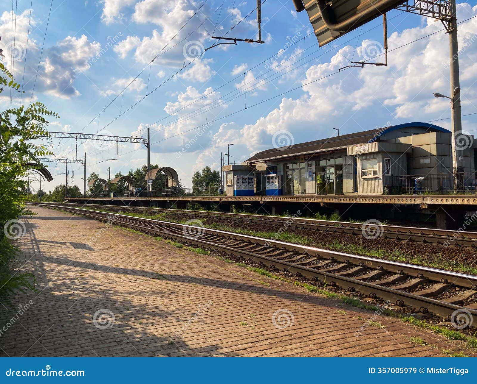 Image of a Railway Station with Multiple Tracks, Partially Hidden Train ...