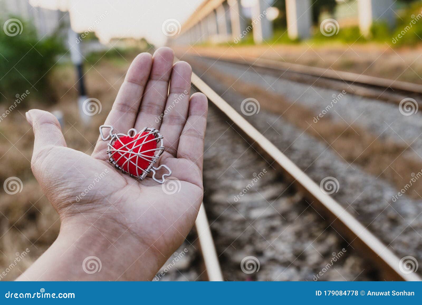 The Image of the Red Heart on the Hand of the Old Train Track ...