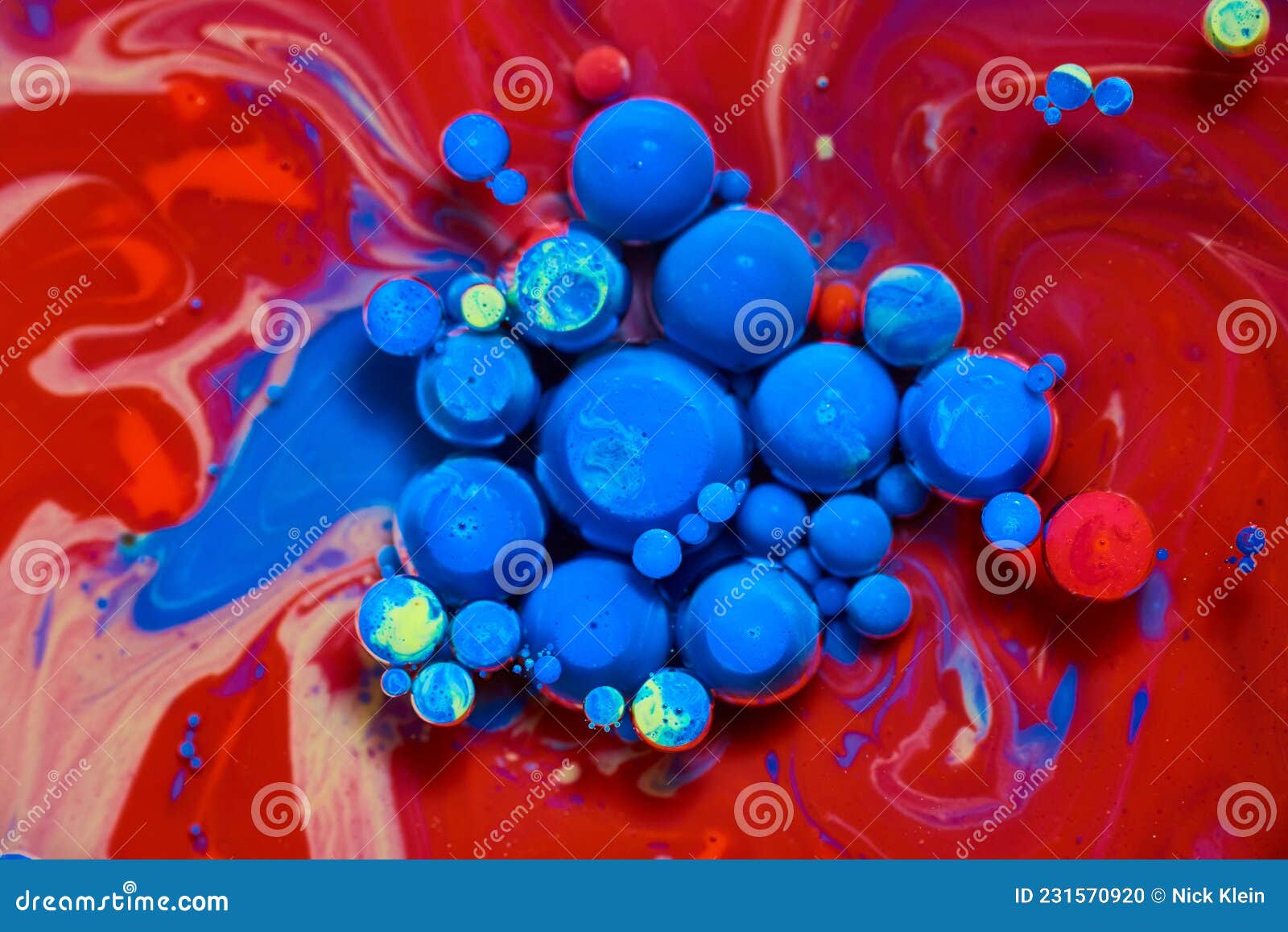 Red Liquid with Blue Orbs Floating on Surface Stock Photo - Image of ...