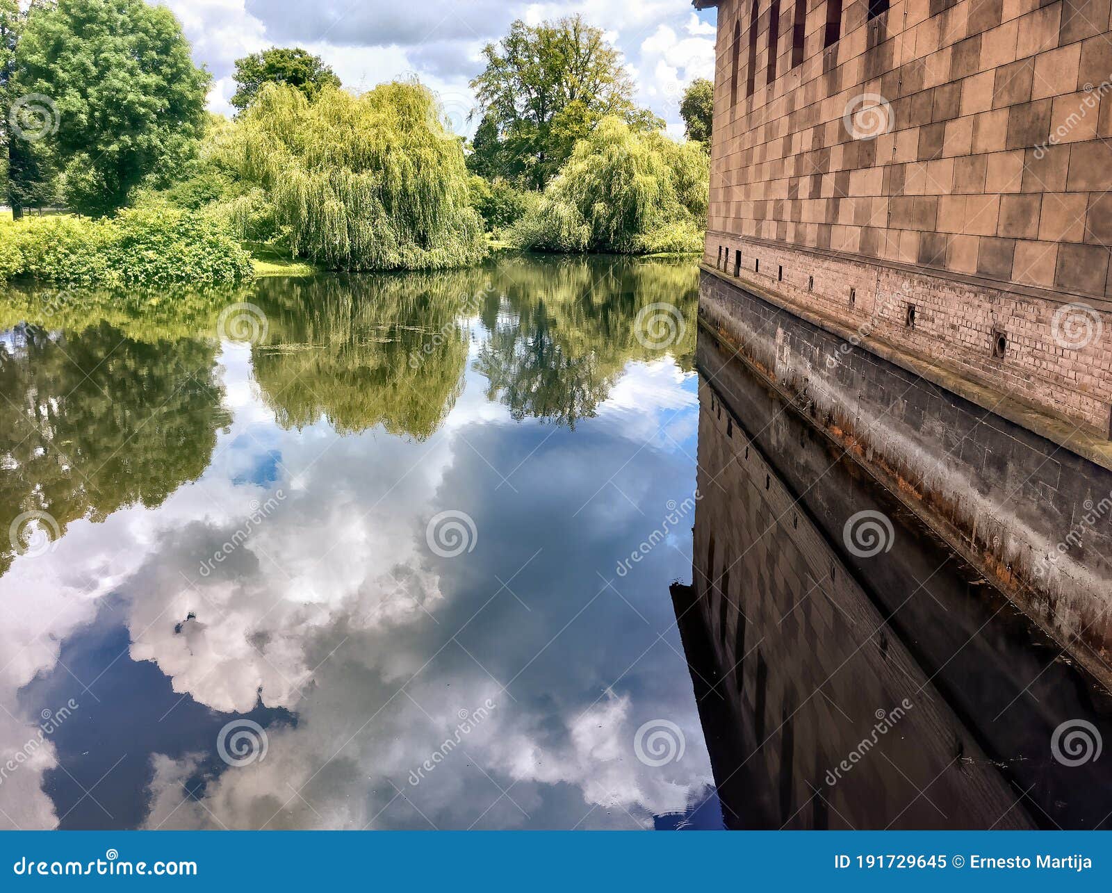 Reflection of a Castle and a Forest, on a Lake that Surrounds Them ...