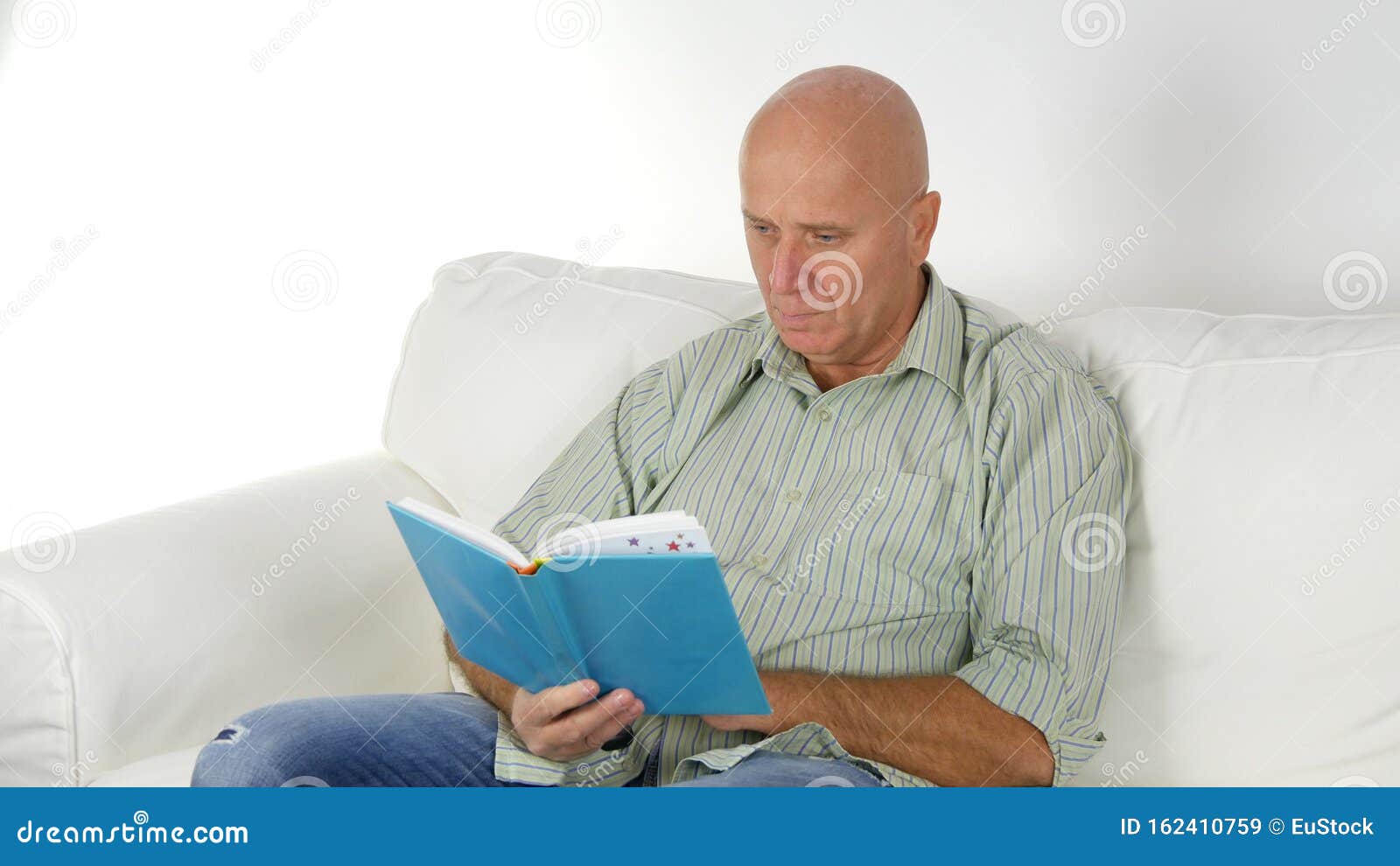 Image with a Relaxed Person Reading a Book on the Sofa Stock Image ...